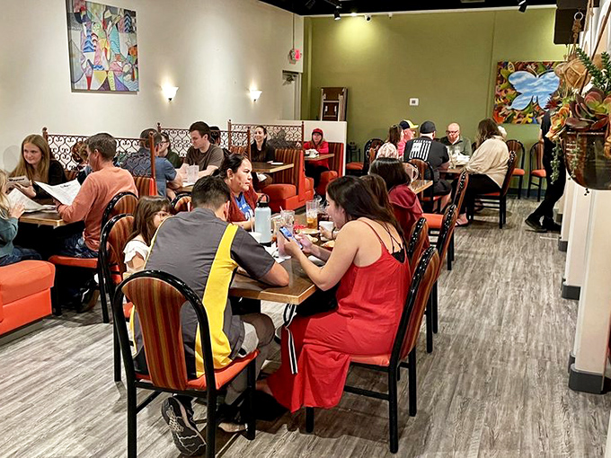 Happy diners fill every table, creating that perfect restaurant buzz that signals you've discovered something truly special and authentic.