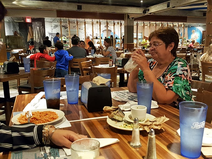 Real seafood enthusiasts in their natural habitat – plotting their next buffet strategy between sips of something cool and refreshing.