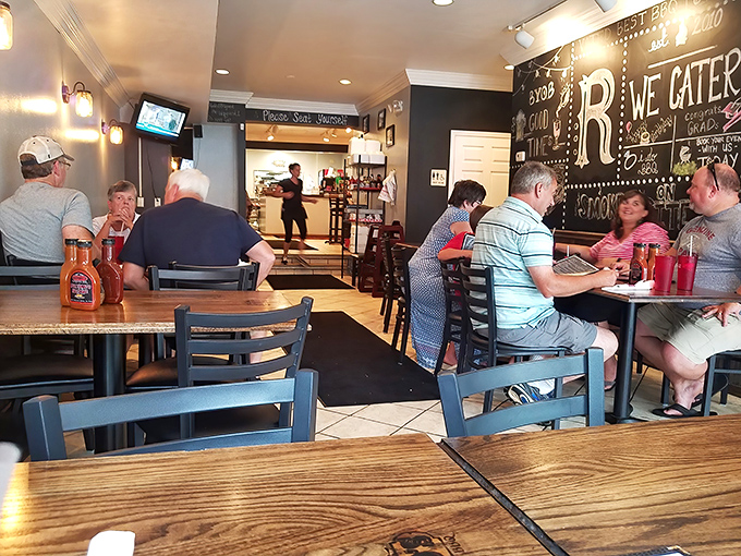 The true measure of a barbecue joint isn't just the food – it's the people willing to gather around tables to share in the smoky bounty..