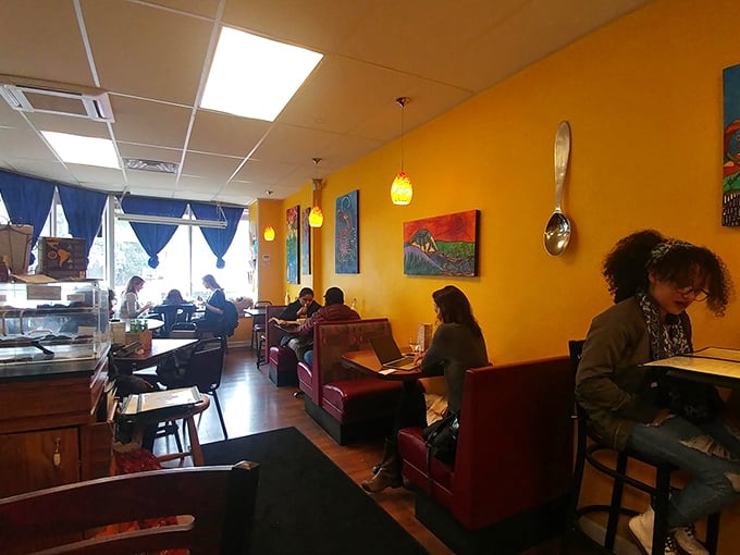 The diverse crowd speaks volumes—Portia's isn't just for committed vegans but for anyone seeking food that's as colorful as the conversations happening around it.