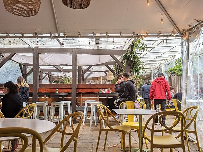 Even in winter, Sunflower's covered patio keeps the al fresco dream alive. Those yellow chairs aren't just furniture—they're mood enhancers.