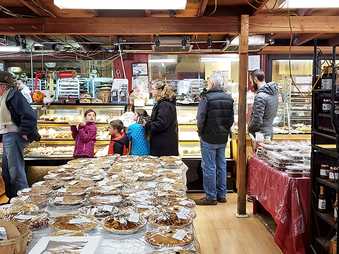 The bakery counter on a busy day – where strangers become friends united by the universal language of "I'll take two of those."