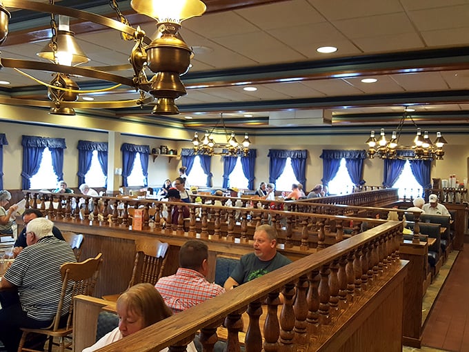 Where strangers become neighbors over coffee refills and shared gravy boats. The blue curtains have witnessed countless family celebrations and morning-after recoveries.