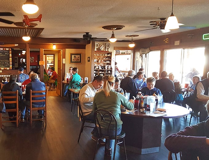 The packed dining room tells you everything you need to know—these people didn't drive from three counties away for mediocre barbecue.