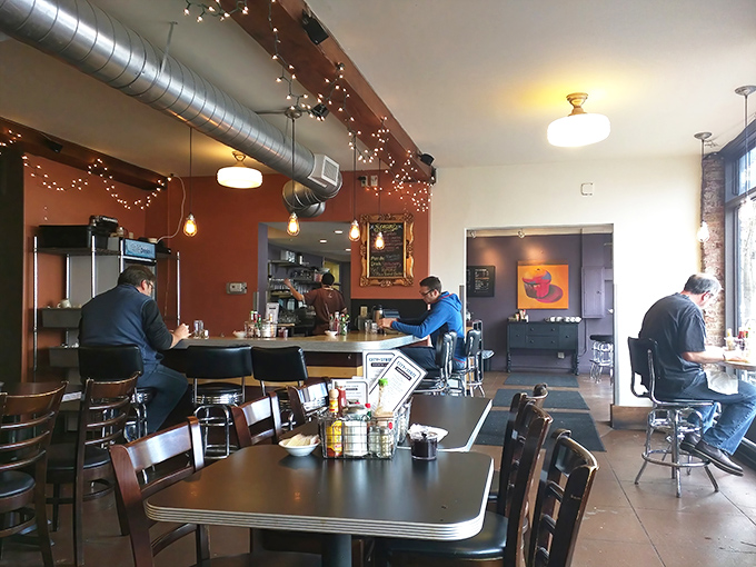 Warm walls, exposed ductwork, and happy diners—the universal language of "good food happens here" needs no translation.