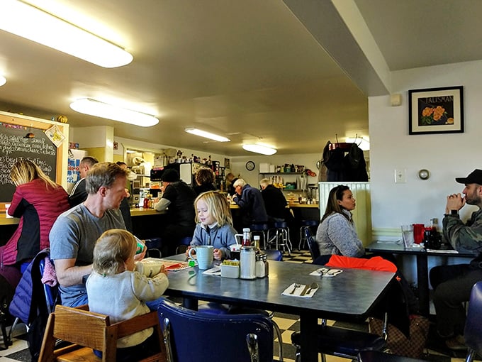 Where breakfast dreams come true—families and friends gathering around steaming mugs of coffee and plates that won't fit on your phone screen.