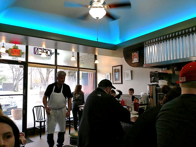 The morning dance of servers and customers—a choreography perfected over years. That apron-clad maestro orchestrates breakfast service with seasoned precision.