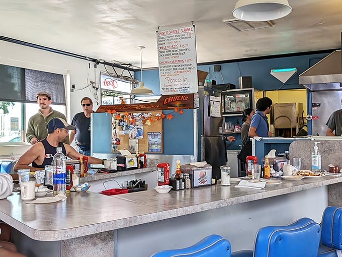 The counter at Chuck's—where strangers become friends over coffee and the staff remembers your order before you do.