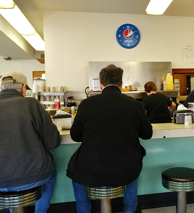 The counter—where regulars perch like birds on a wire, sharing news, weather reports, and occasional life wisdom.