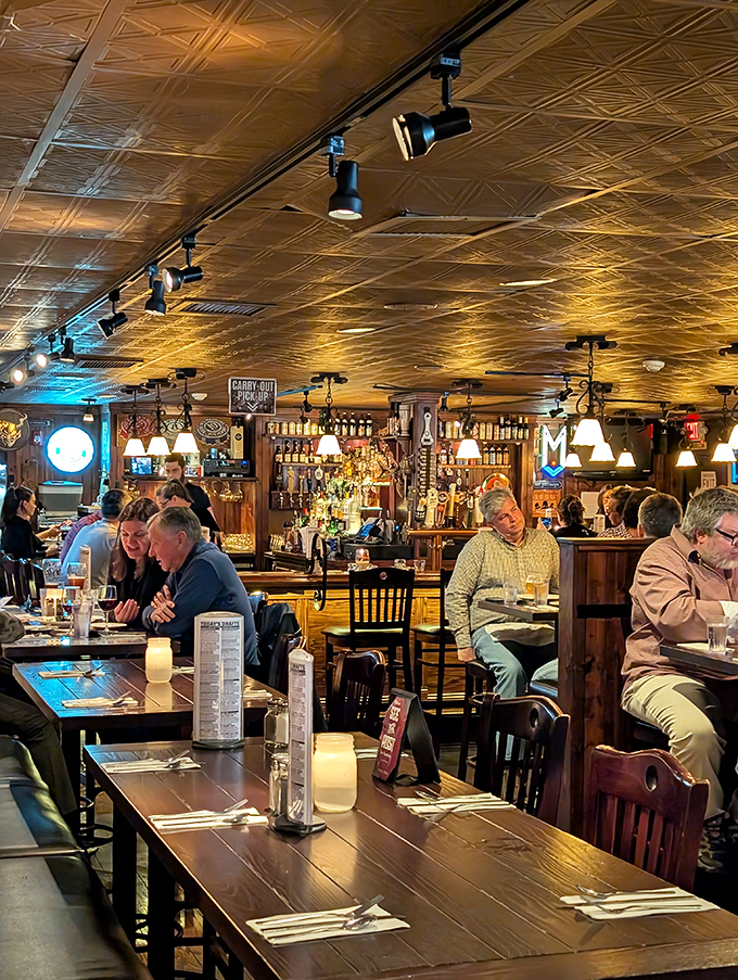 Where strangers become friends over steins and schnitzel. Notice how nobody's looking at their phones—the food commands full attention.