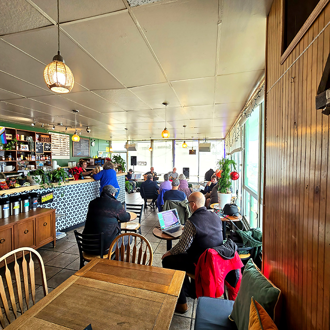 The true measure of a local cafe—regulars who've claimed their favorite spots, laptops open, coffee steaming, solving the world's problems one refill at a time.