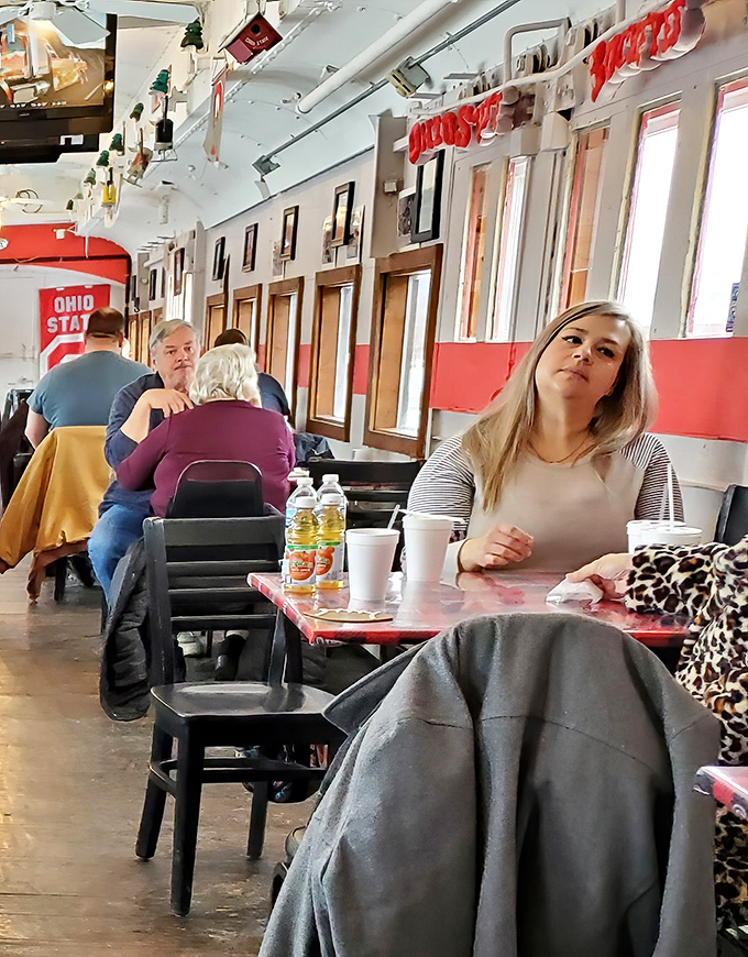 Every good diner has its regulars—the folks who've turned these booth seats into their second kitchen table, complete with coffee cup indentations.