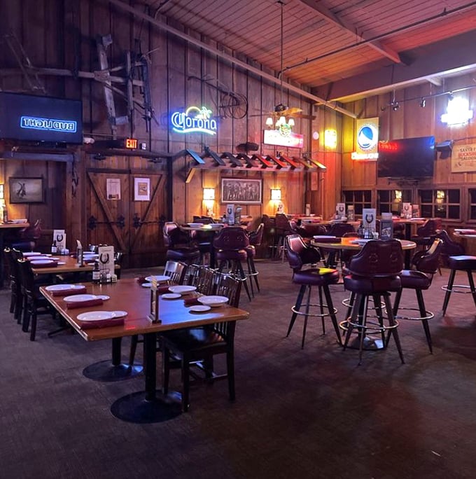 The bar area—where sports on TV, neon beer signs, and the promise of perfectly grilled meat create a trifecta of happiness.