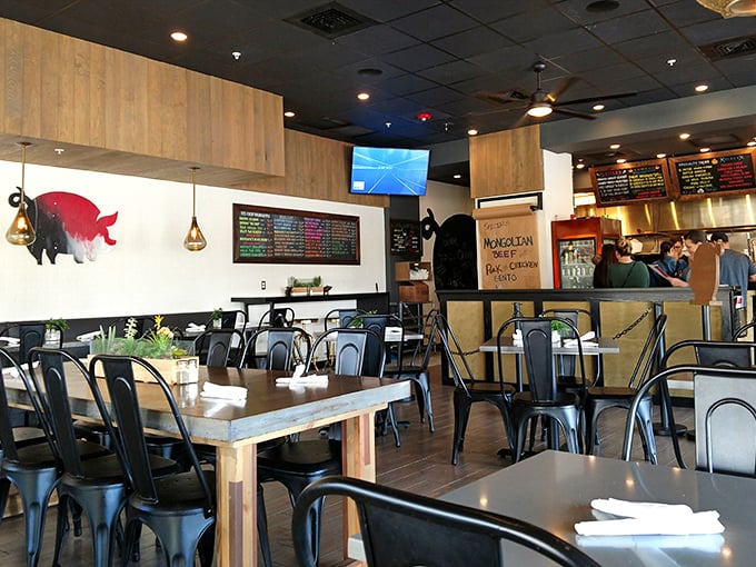 The dining area balances rustic charm with urban edge—a space where barbecue traditionalists and culinary adventurers find common ground over smoky delights.
