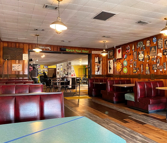 Red vinyl booths and wood-paneled walls—the universal language of "sit down and stay awhile."