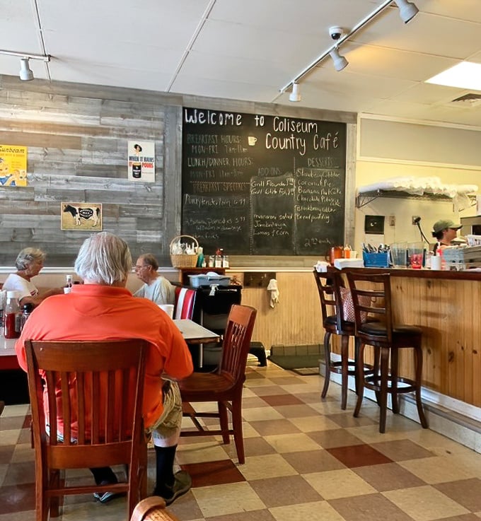 The chalkboard doesn't just list specials – it whispers promises of comfort food that your diet plan hopes you didn't hear.