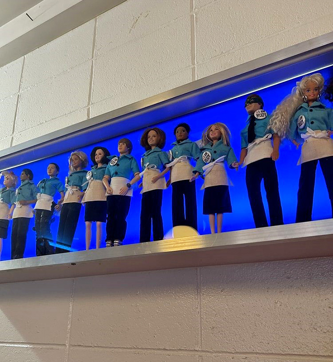 Rudy's quirky decor includes this blue-lit display of uniformed dolls—a whimsical touch that adds to the diner's unique personality.