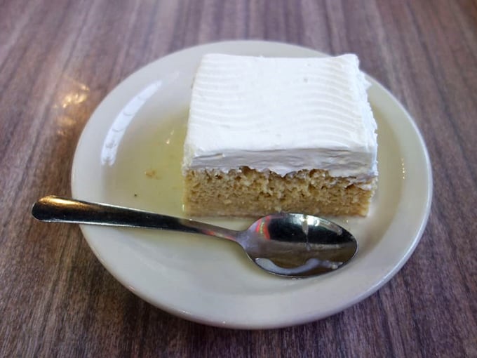 Tres leches cake that achieves the impossible balance between cloud-like lightness and decadent richness—dessert nirvana achieved.