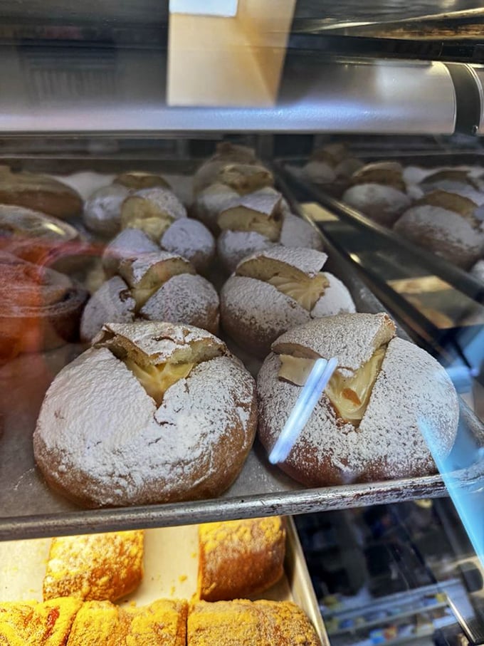 These cream-filled treasures dusted with powdered sugar aren't just pastries—they're little clouds of joy that make you wonder why you ever ate anything else.