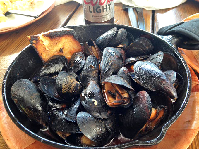 Mussels that have clearly been introduced to fire and decided they're best friends—a cast iron skillet of oceanic perfection.