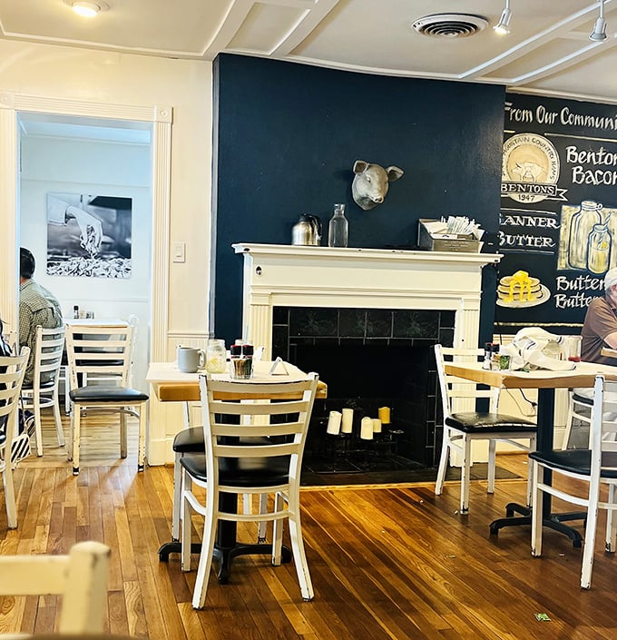 The fireplace wall tells the story: Benton's Bacon, Banner Butter, and full-fat buttermilk—the holy trinity of Southern breakfast excellence.