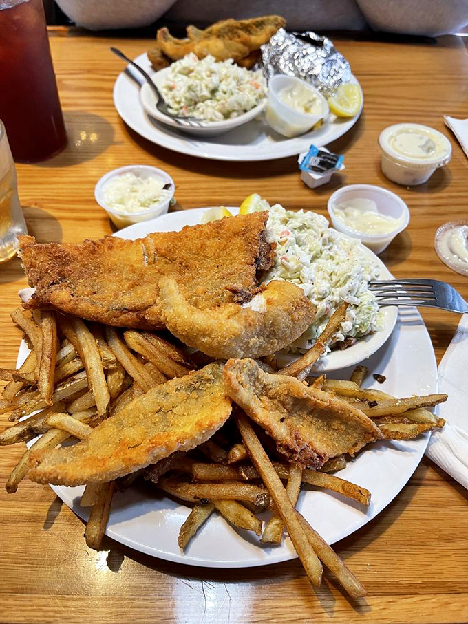 Fish and chips that could make a British pub-goer weep with joy, paired with fries that deserve their own fan club.