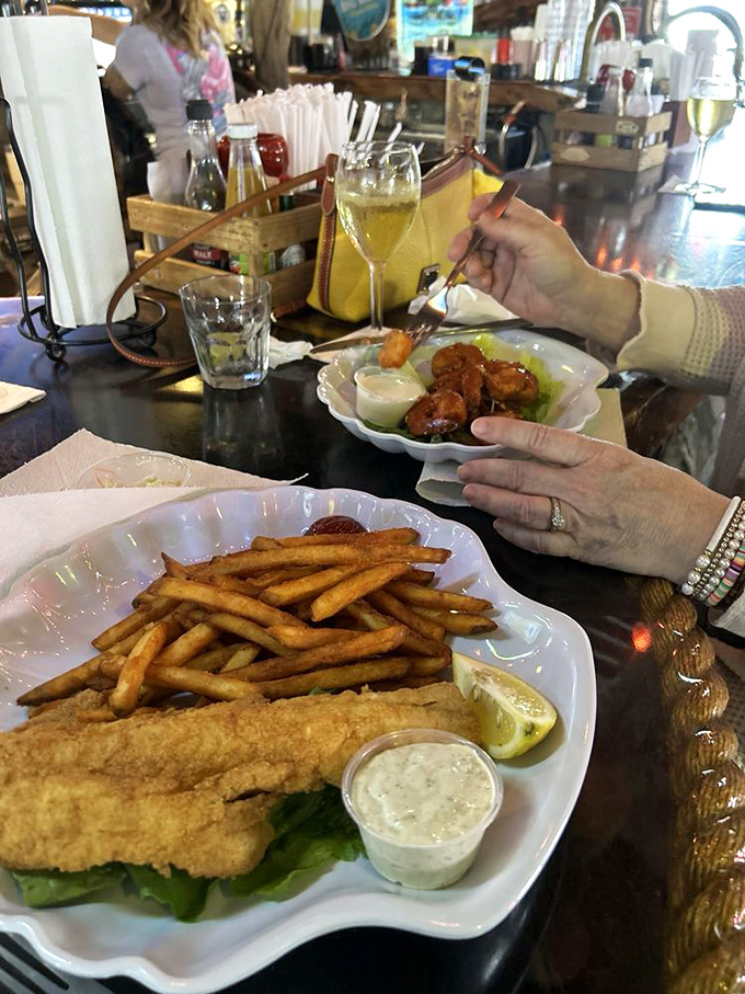 The fish and chips here aren't trying to impress the Queen—they're too busy impressing your taste buds with fresh-caught simplicity.