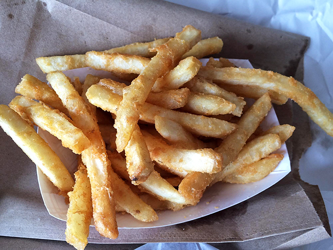 Golden, crispy fries that crackle with each bite – the perfect sidekick to any sandwich adventure. These aren't just sides, they're co-stars. 