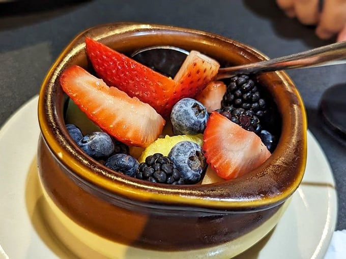 A bowl of berries so fresh and vibrant they could make a fruit stand jealous—nature's candy providing a virtuous counterpoint to those biscuits you just inhaled.