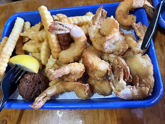 These fried shrimp aren't just golden—they're the Olympic champions of seafood baskets. Crispy, plump, and ready for their victory lap.