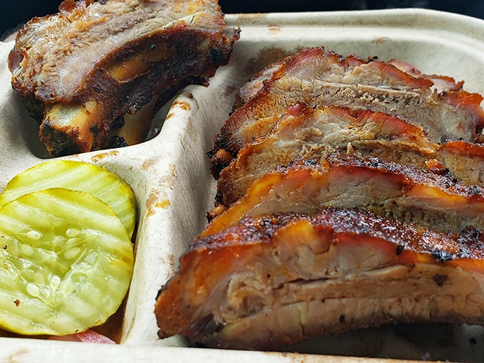 Ribs with a smoke ring so perfect it could be framed. Fall-off-the-bone tender, yet somehow still has that essential chew.