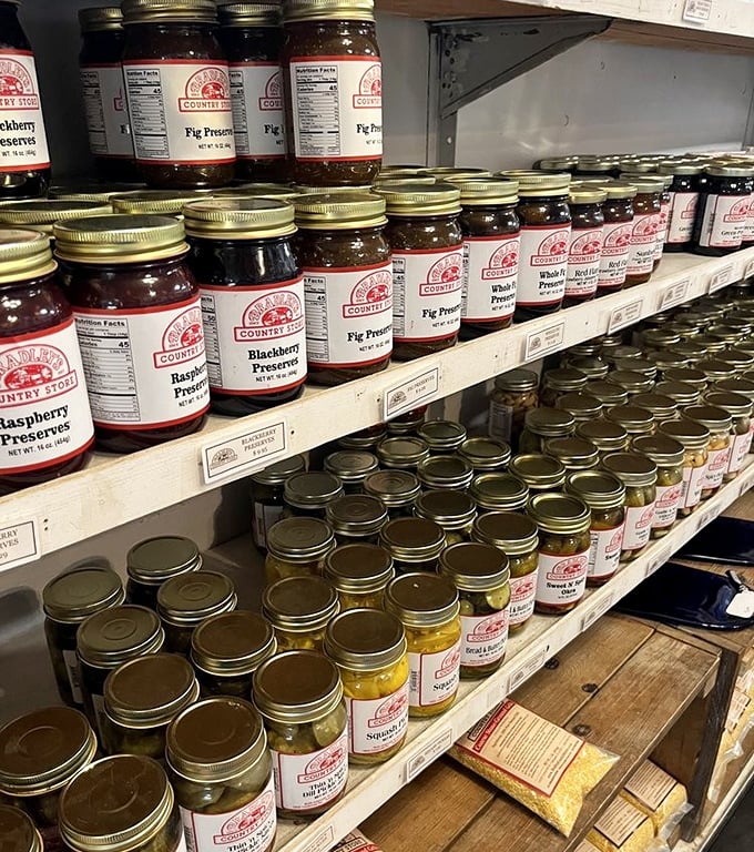 Mason jars lined up like edible jewels—preserves that capture summer's essence better than any vacation photo ever could. 
