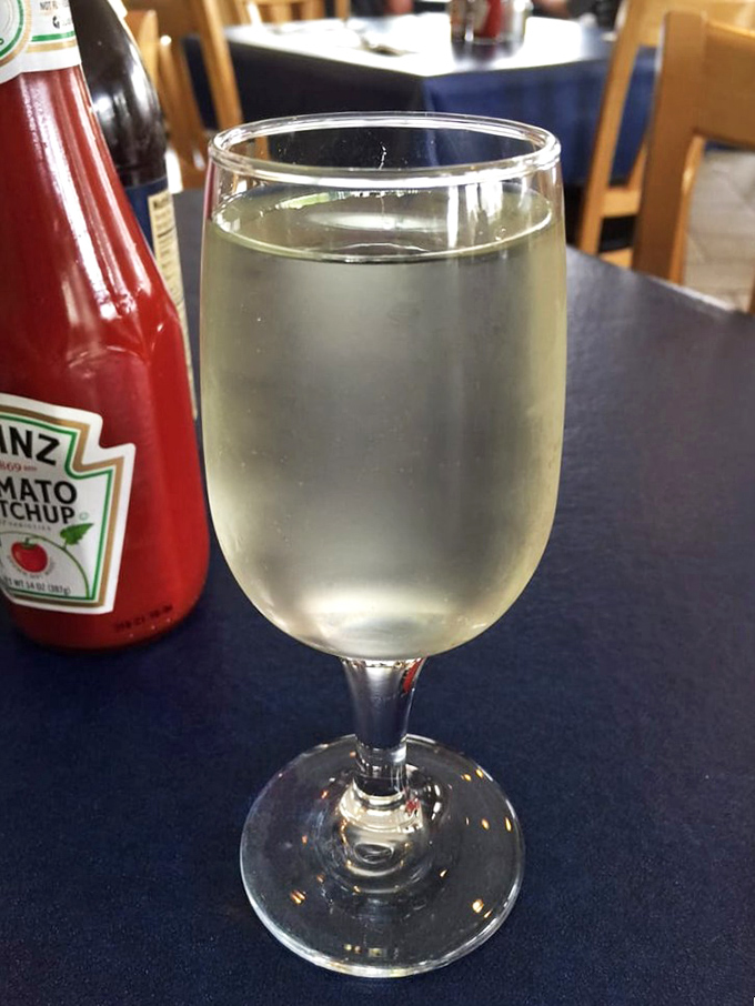 A glass of crisp Sauvignon Blanc waiting to complement your seafood feast. Wine and fish—a relationship that's stood the test of time.