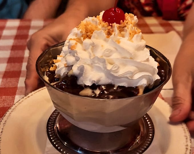 Hot fudge sundae architecture at its finest. The cherry on top isn't just garnish—it's the exclamation point on a sweet sentence.