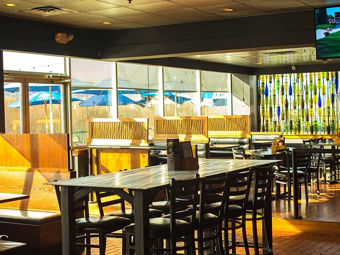 Sunlight streams through large windows, illuminating wooden booths and creating the perfect backdrop for a leisurely weekend brunch.