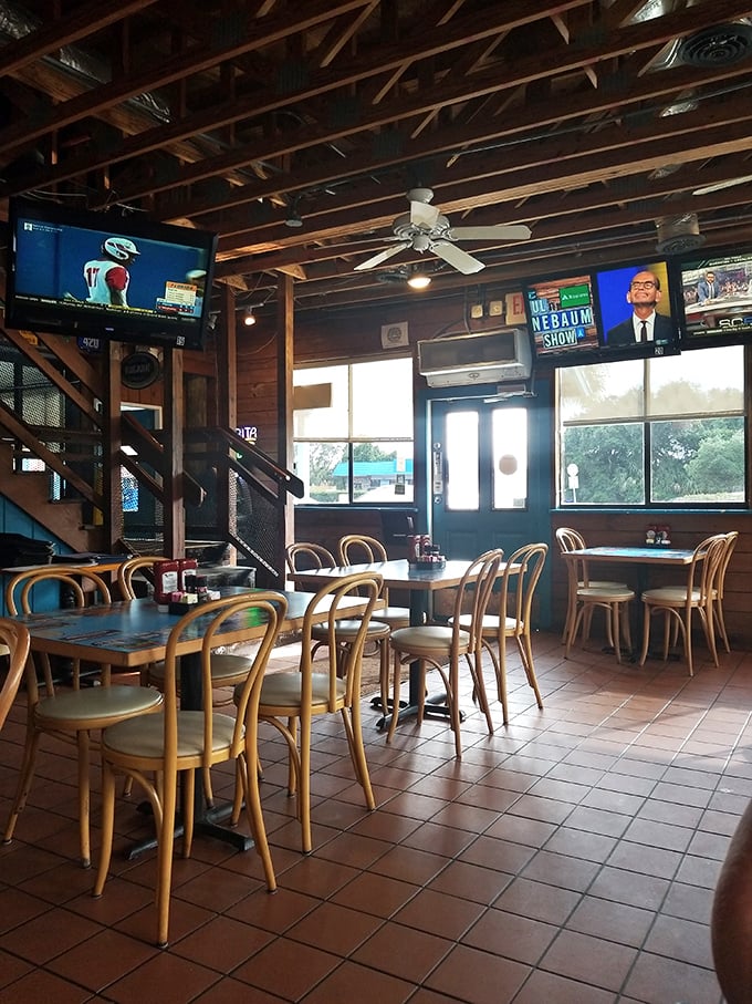 Another angle reveals the restaurant's casual charm – where TVs show the game but nobody's really watching because the food demands full attention.