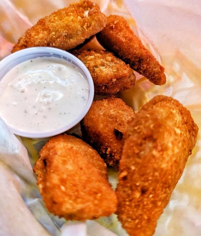 Golden-fried jalapeño poppers that deliver the perfect ratio of crunch to cream—the tavern food equivalent of finding the perfect dance partner.