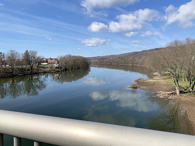 The Juniata River mirrors perfect Pennsylvania skies, creating a double dose of serenity that no meditation app could ever replicate.
