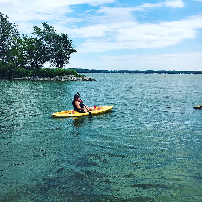 Crystal clear waters and a bright yellow kayak—the perfect recipe for adventure. Lake Erie showing off its Caribbean-blue credentials on a perfect summer day.