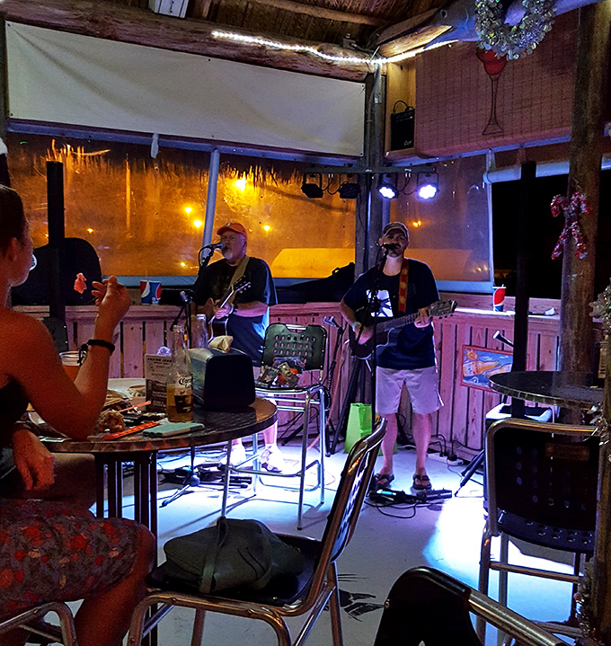 Even the music feels authentically Keys—laid-back tunes that pair perfectly with cold drinks and warm evening breezes off the water.