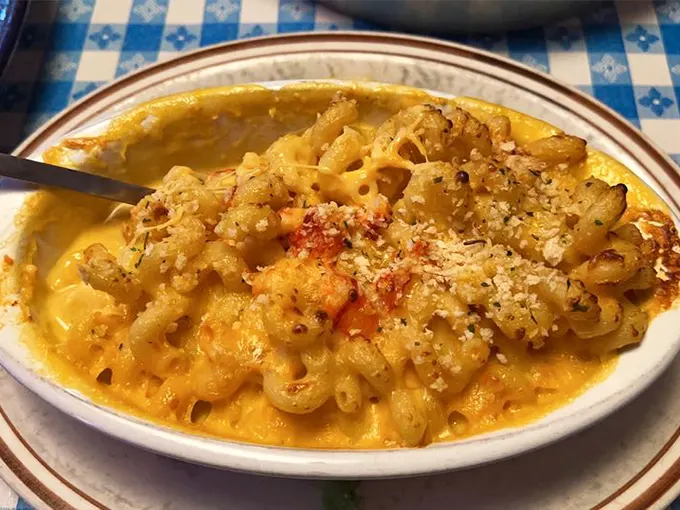 Mac and cheese that's had a glow-up worthy of a Hollywood makeover. That golden crust on top is the culinary equivalent of a perfect sunset.