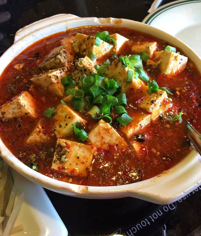 Mapo tofu that doesn't hold back on flavor – silken cubes swimming in a crimson sea of spicy sauce that tingles without overwhelming the palate.