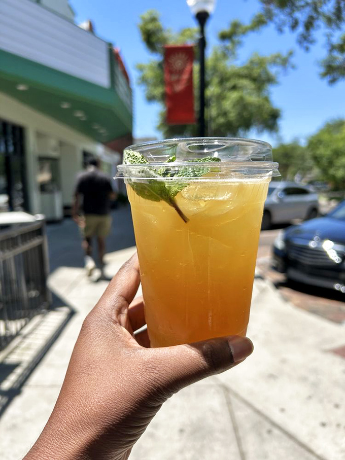 Holding liquid sunshine against the backdrop of Winter Garden's historic downtown – summer in a cup.