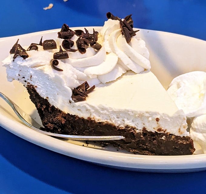 Mississippi mud pie that makes you consider ordering dessert first. That mountain of whipped cream isn't just decoration—it's a life philosophy.