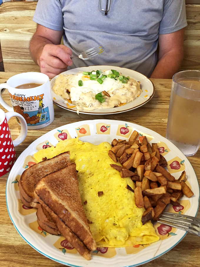 This omelet doesn't just sit on the plate—it commands attention like a Broadway star taking center stage. 