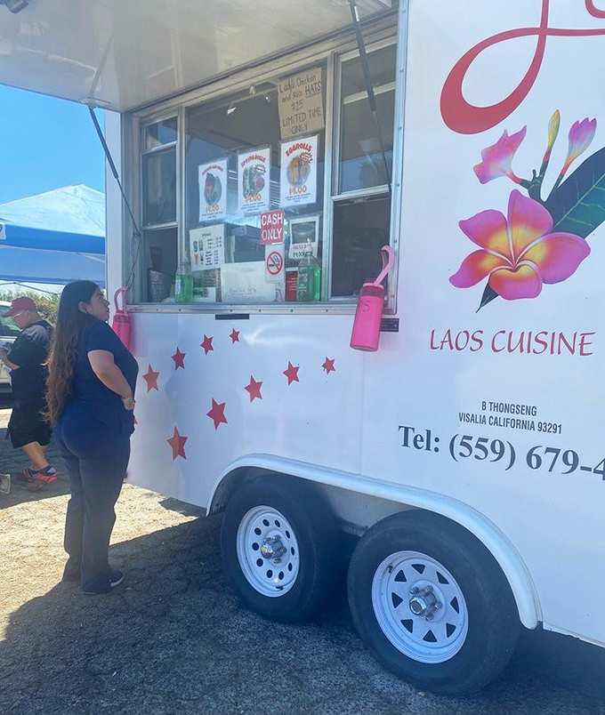 The ordering window—where dreams come true and strangers become friends while waiting for their chicken and rice, united by imminent deliciousness.
