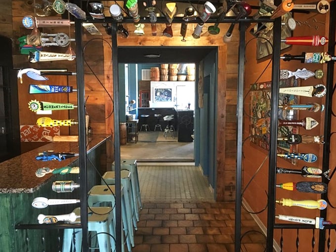 Beer taps framed by tap handles like a gallery of liquid art. The entrance to flavor town is right through here.