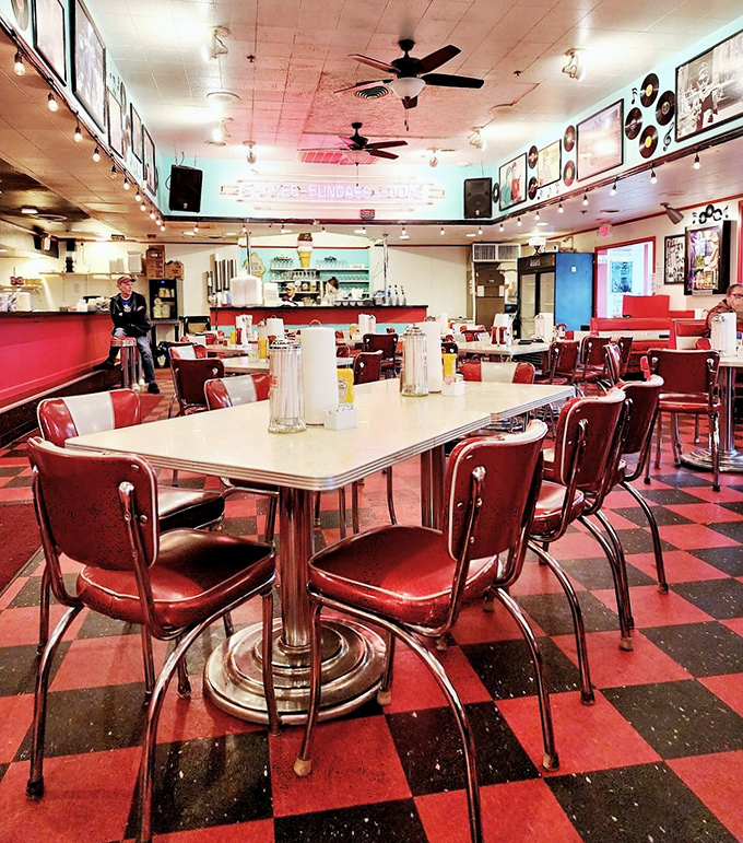 Chrome, vinyl, and neon create the perfect backdrop for memories made over malts and melodies.