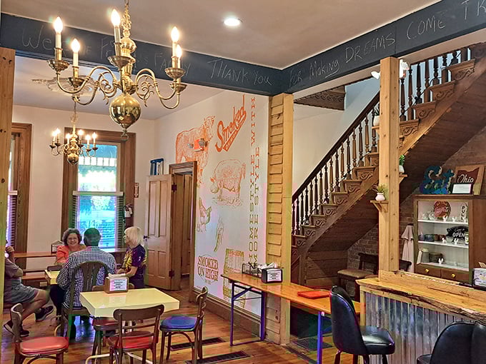 That chandelier hanging above barbecue tables? It's like Downton Abbey and Texas had a delicious baby. Note the pig artwork—a fitting tribute.