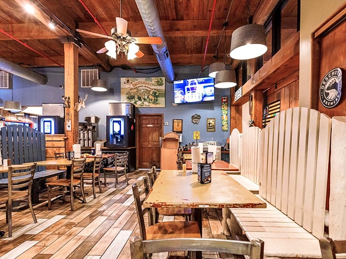 Wooden beams, rustic tables, and blue accents create the perfect backdrop for the serious business of BBQ appreciation.